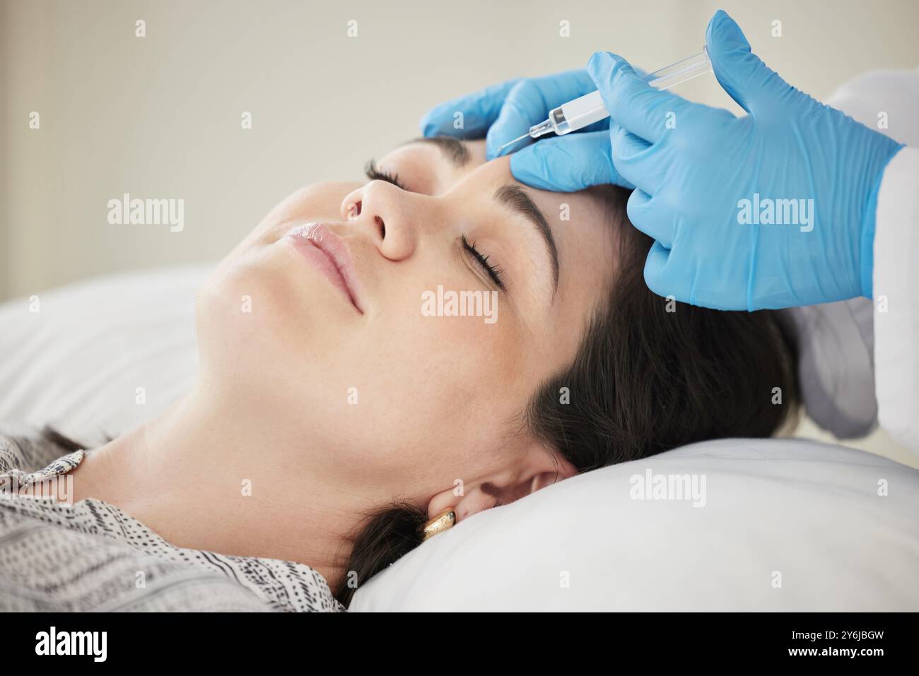 Hands, woman and eyes closed with injection for botox in hospital bed ...