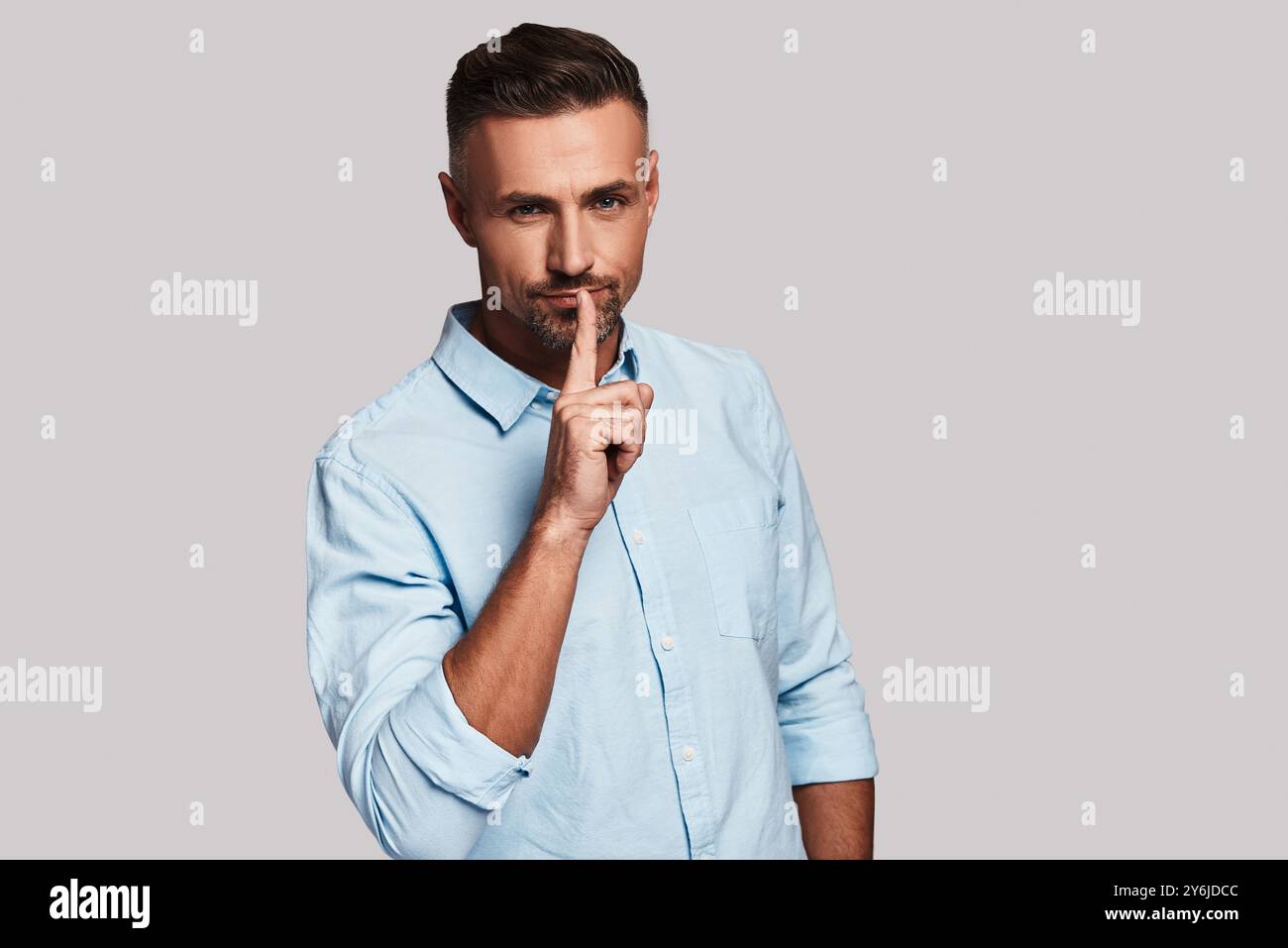 Shhh thoughtful young man hi-res stock photography and images - Alamy