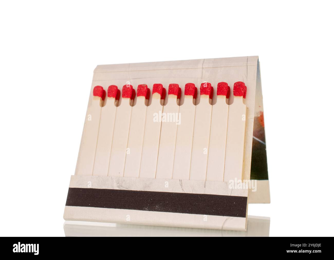 Wooden matches in a paper box for lighting a fire, macro, isolated on a ...