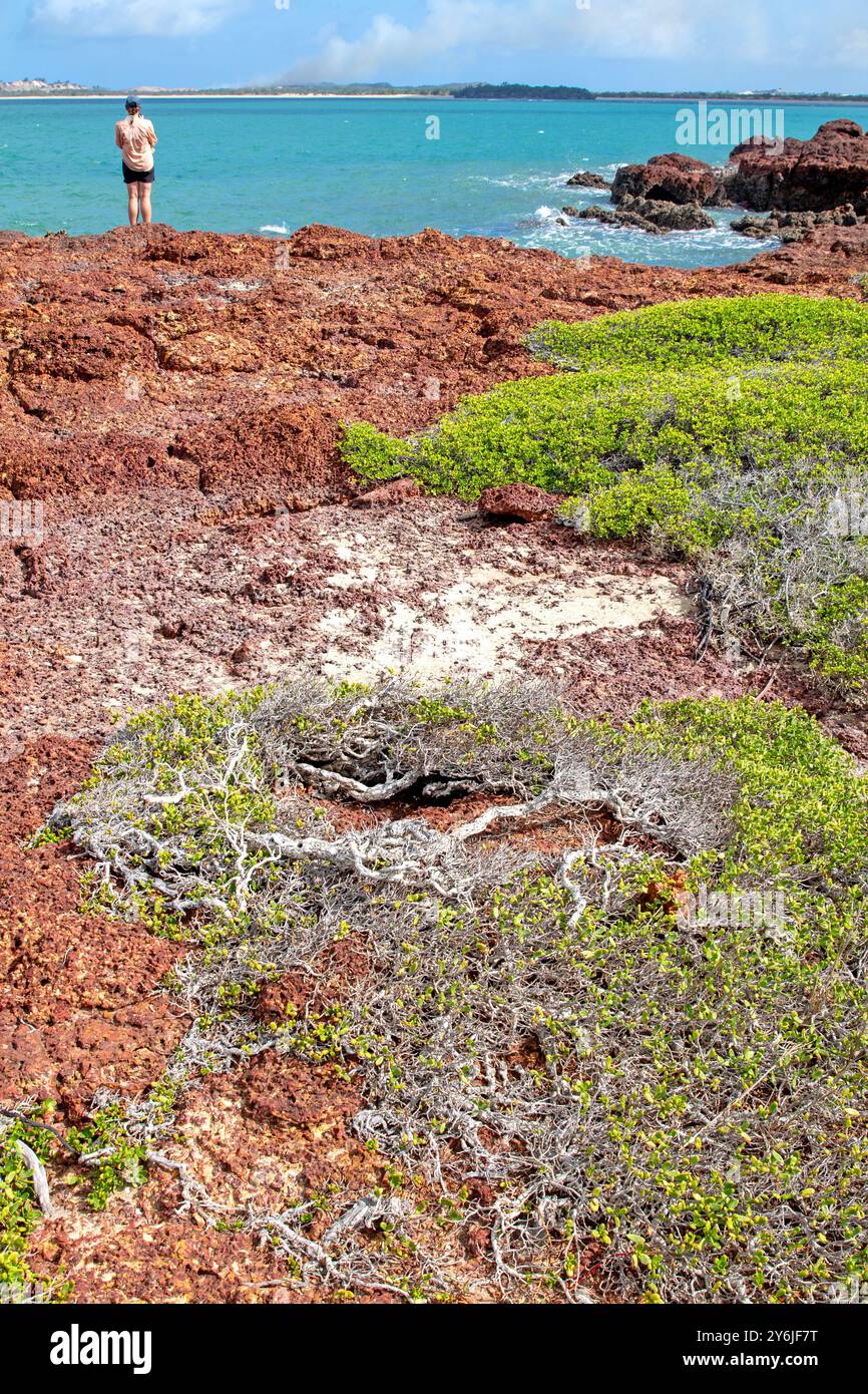 Woman at the cliff edge at Macassan Beach (Garanhan Stock Photo - Alamy