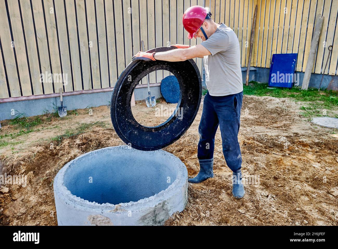 Installation of support ring for septic tank manhole cover made of ...