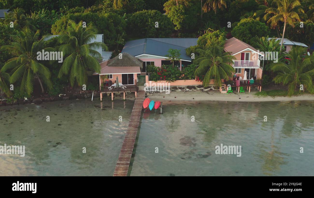 Aerial view of colorful bungalows houses on coast of Bora Bora island ...