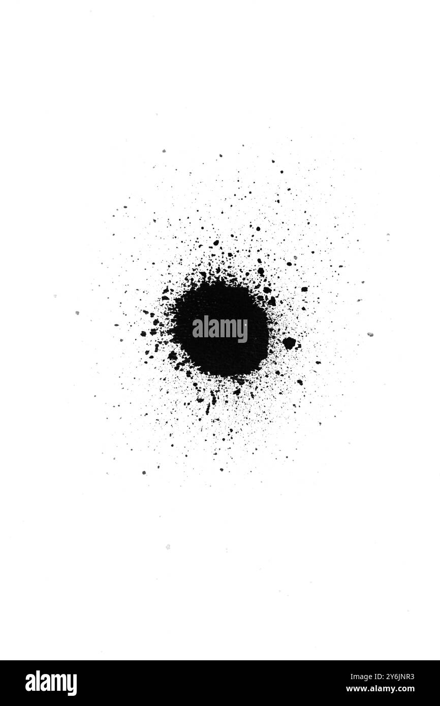 Black color spray paint on a white background paper Stock Photo - Alamy