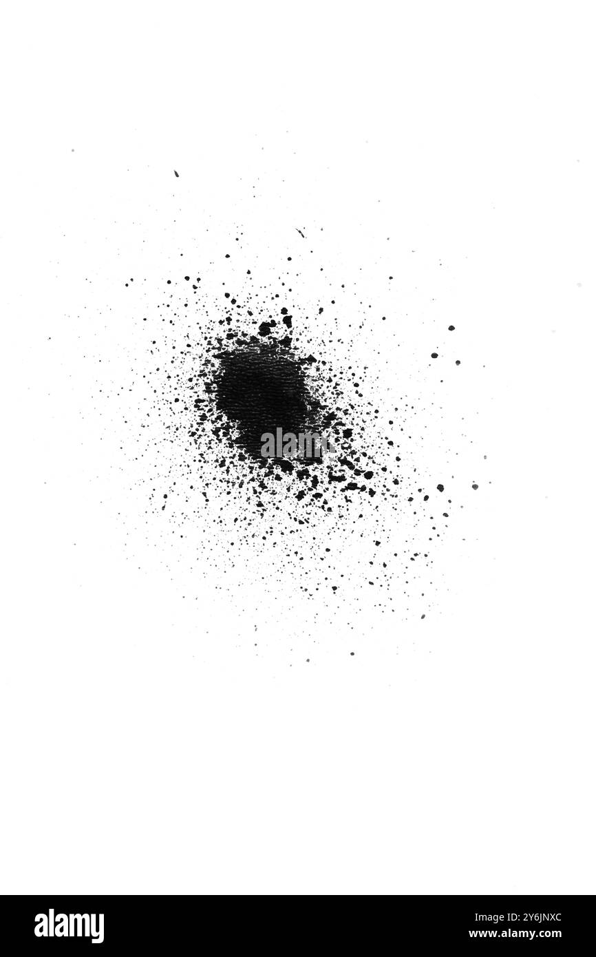 Black color spray paint on a white background paper Stock Photo - Alamy