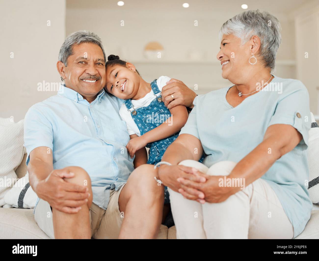 Love, family and smile in home, bonding and fun in living room on house ...