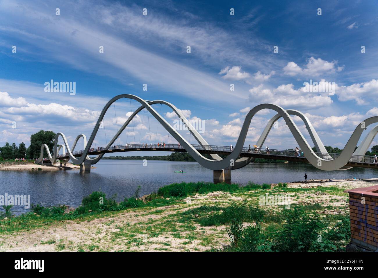 The Wave of Azov pedestrian bridge in Kyiv park Natalka Stock Photo - Alamy