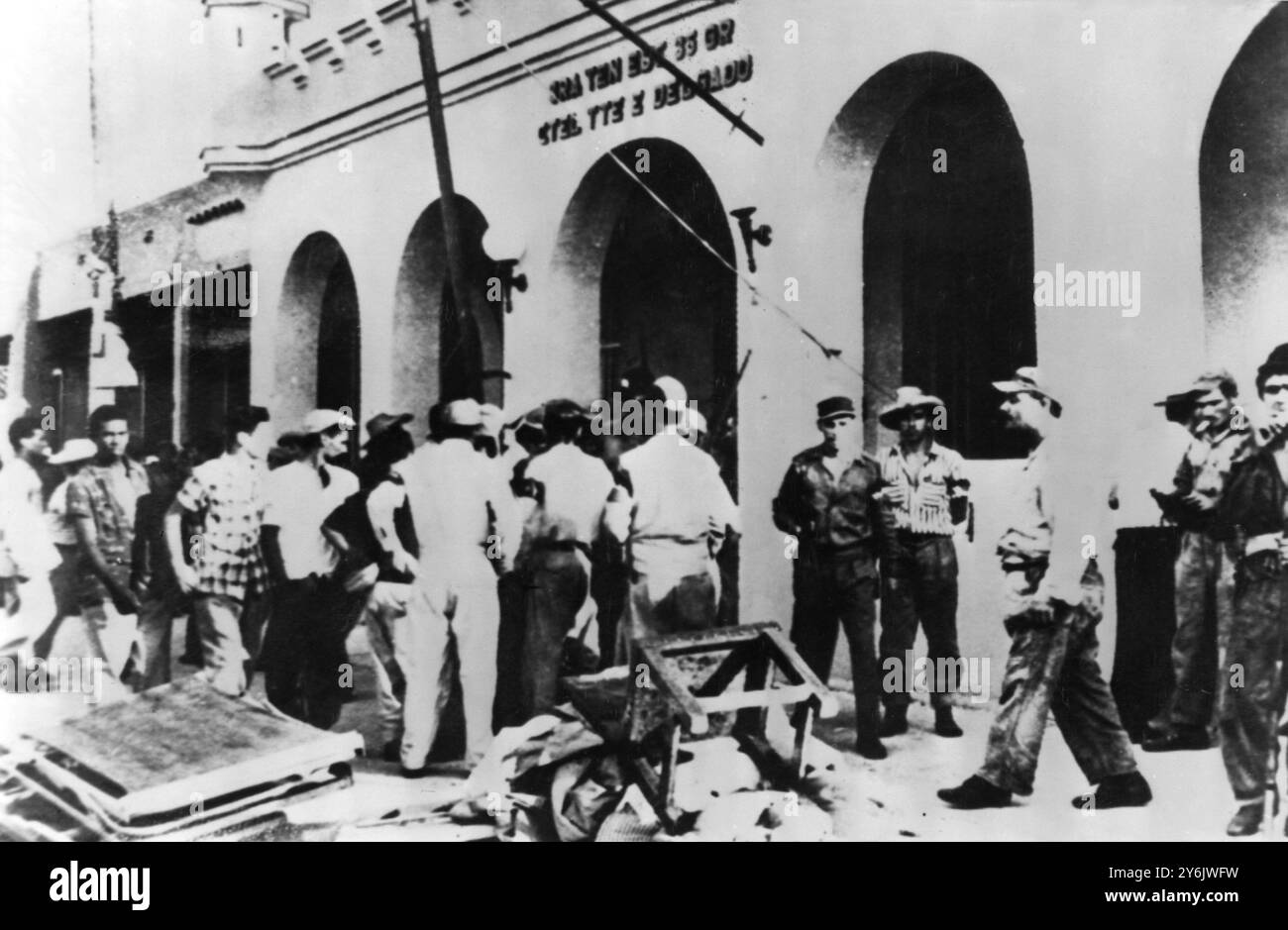 Santo Domingo , Cuba Town residents swarm around troops in front of ...