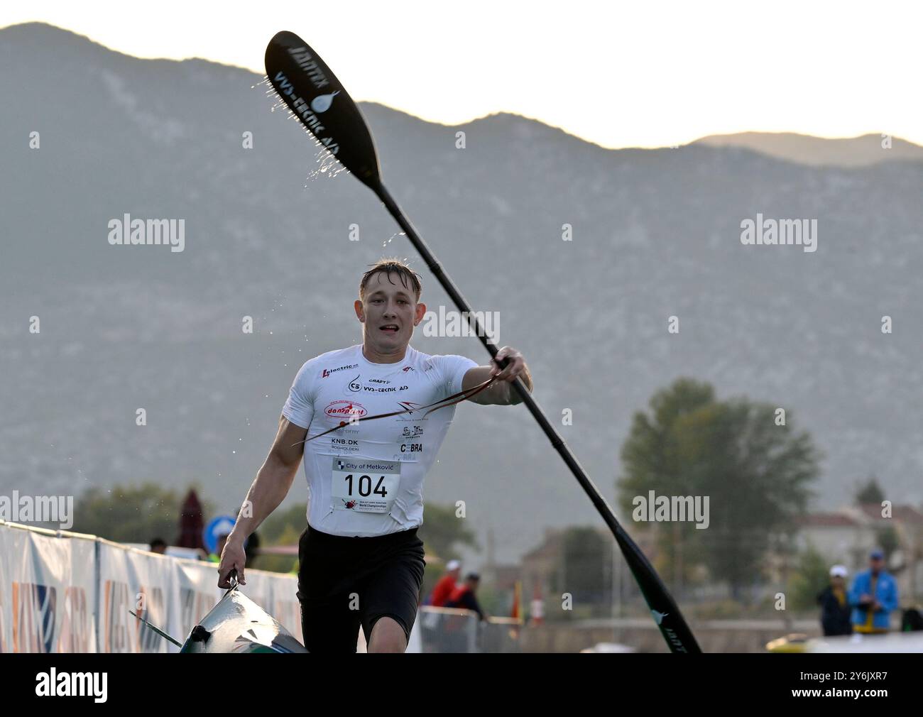 Philip Knudsen (DEN) removes some seaweed as he goes through the ...