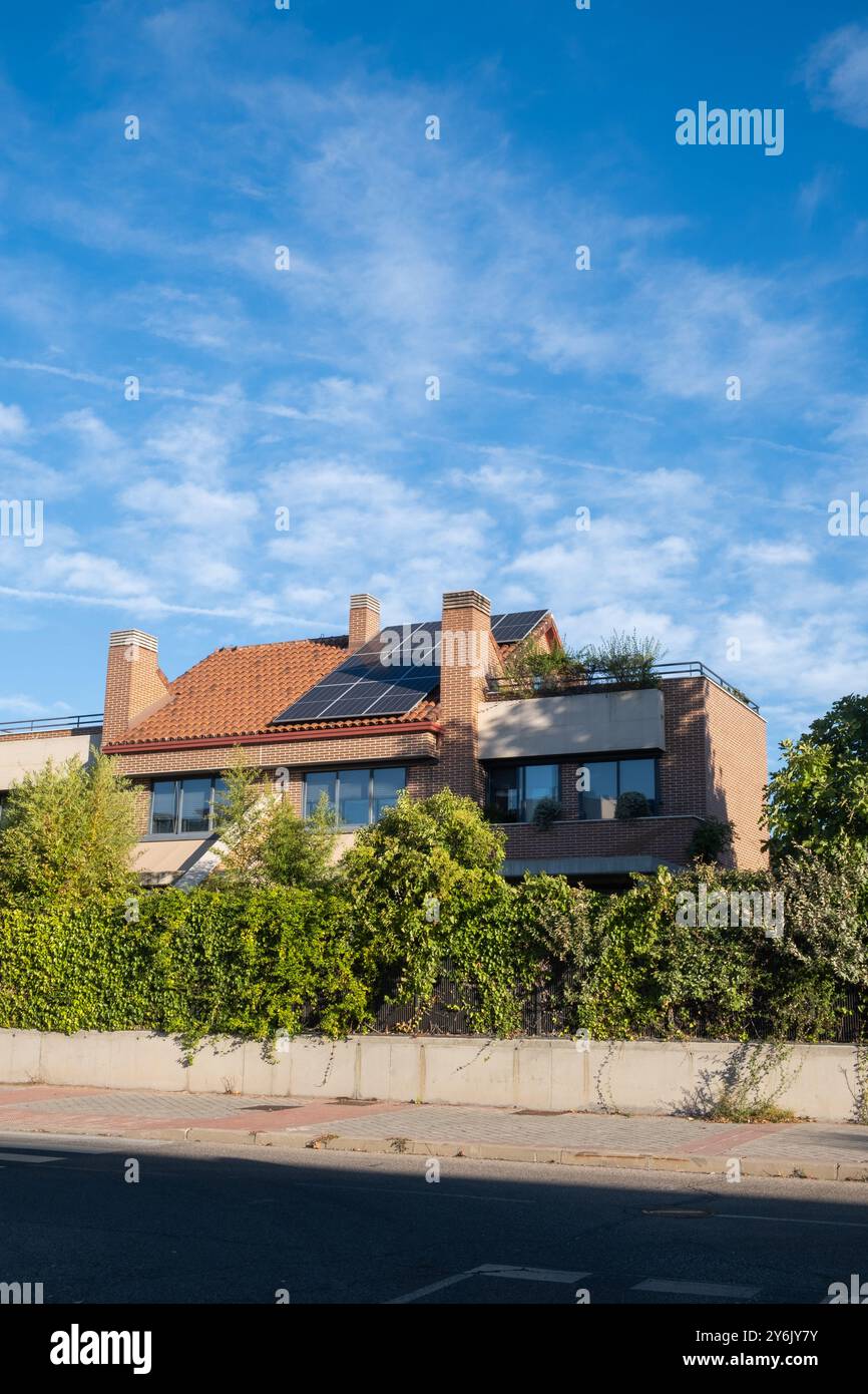 large individual brick house with an installation of photovoltaic solar ...