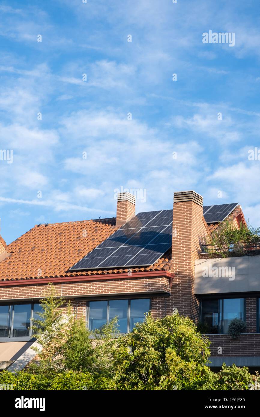 detail of a house with an installation of photovoltaic solar panels to ...