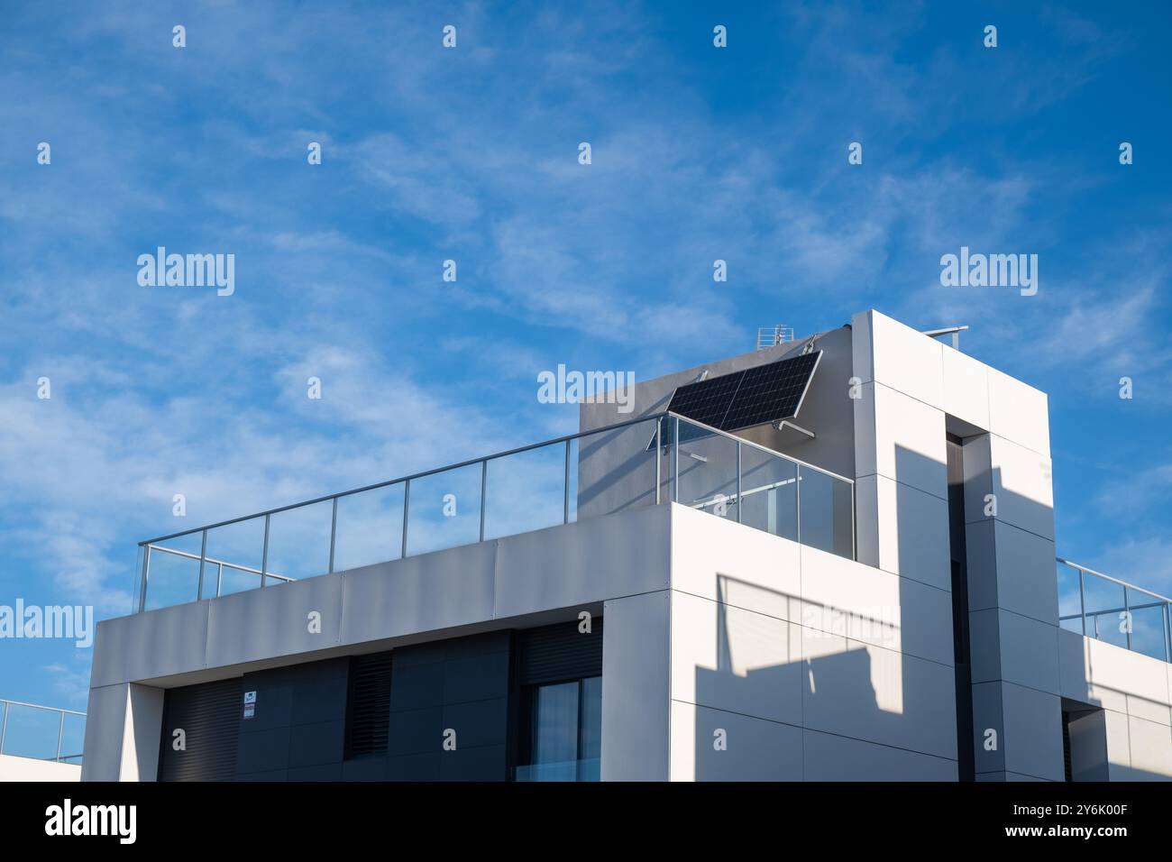 side view of a modern architecture chalet with an installation of ...