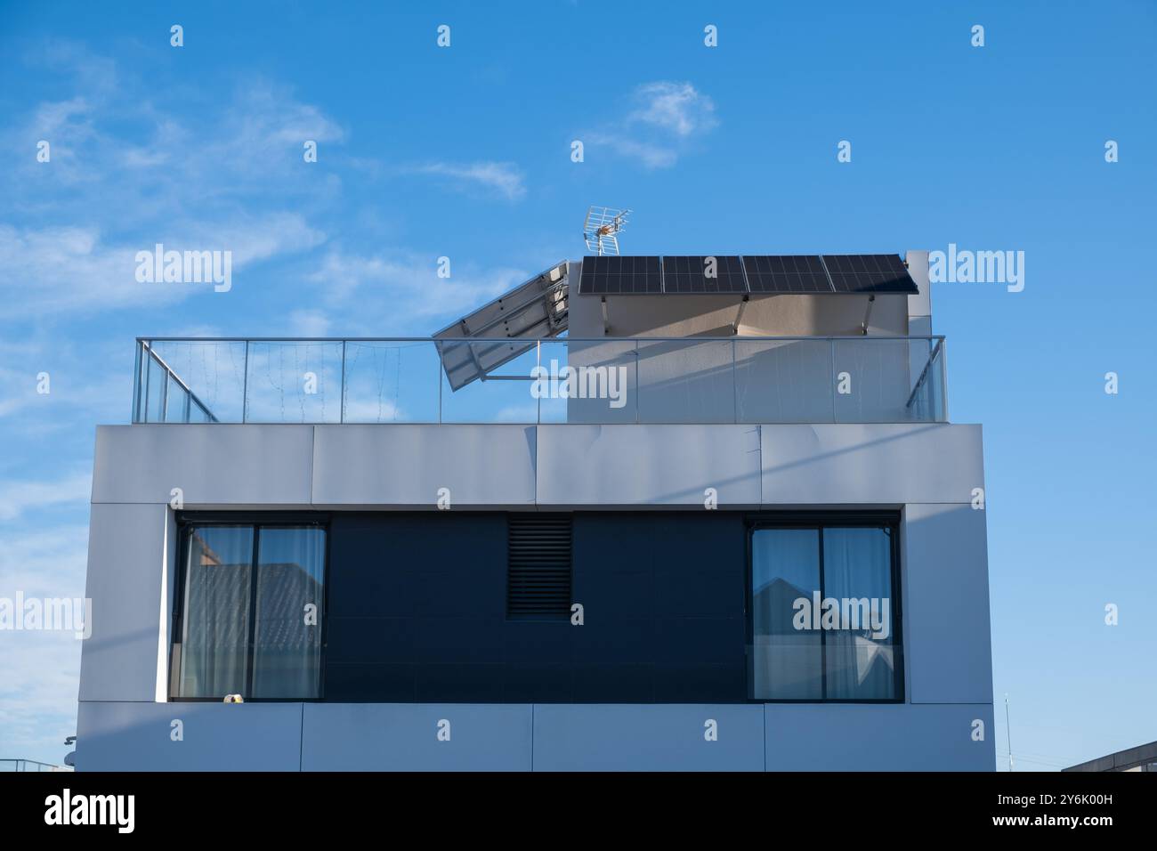 a modern architecture chalet with an installation of photovoltaic solar ...