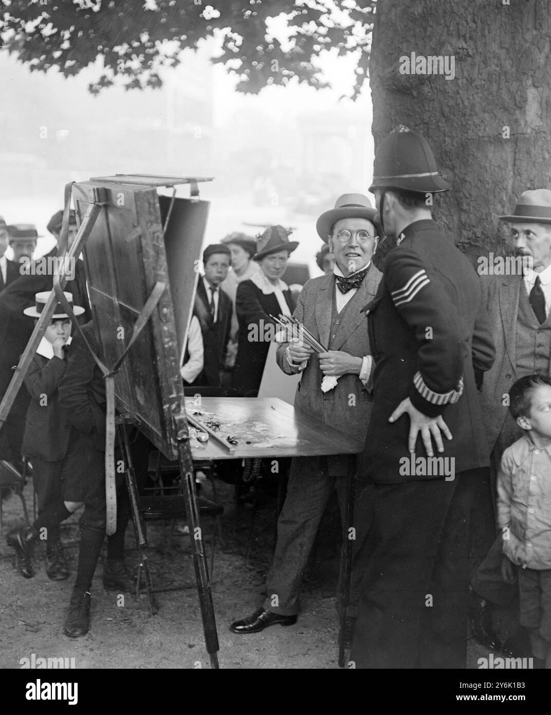 Mr John Lavery painting ' The Heroes of Loos ' in the park . being ...