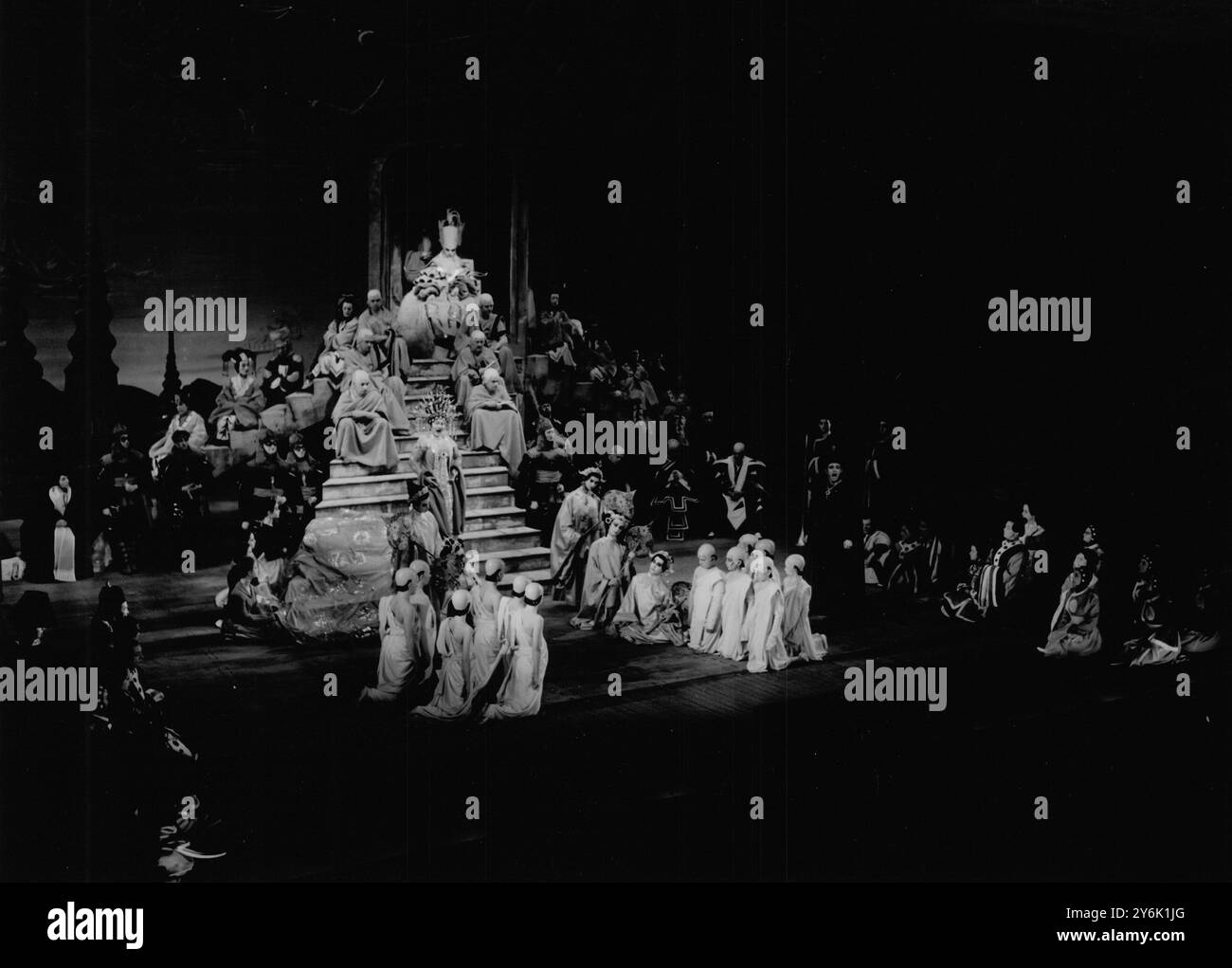 Joseph Ward as the Emperor seated on throne atop of steps and Amy ...