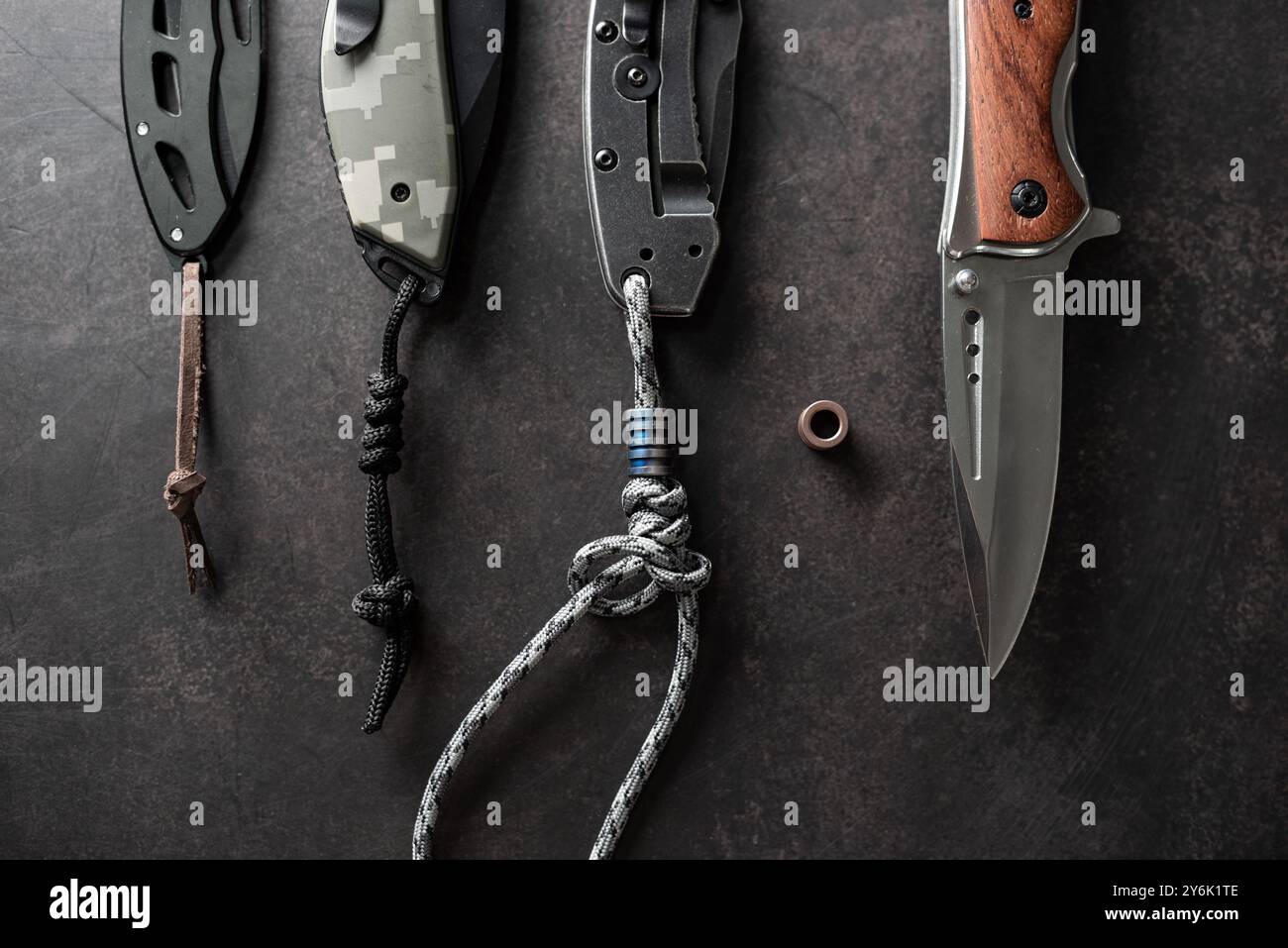 Close up the knife lanyard weaving from paracord rope Stock Photo - Alamy