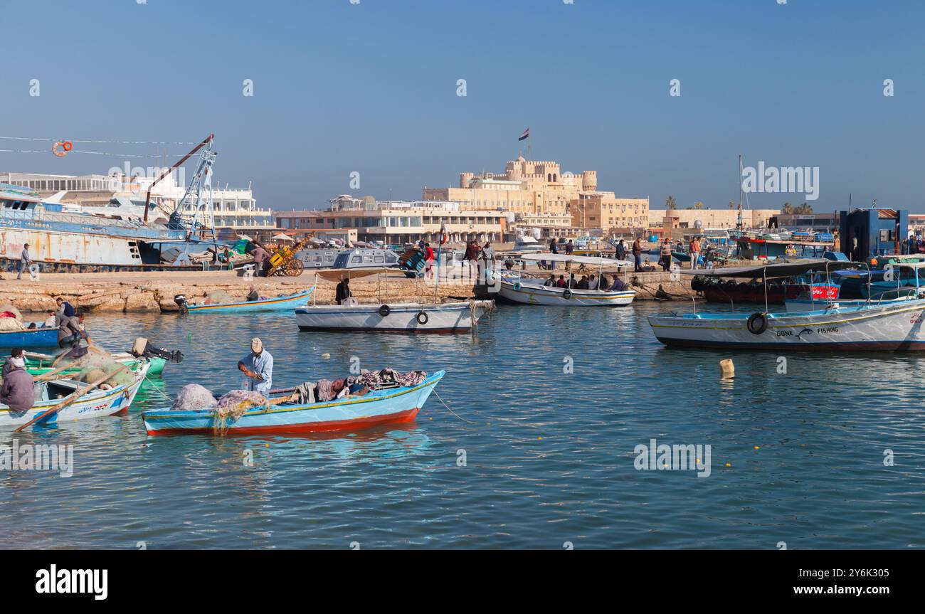 Alexandria, Egypt - December 14, 2018: Fishermen in wooden boats. The ...