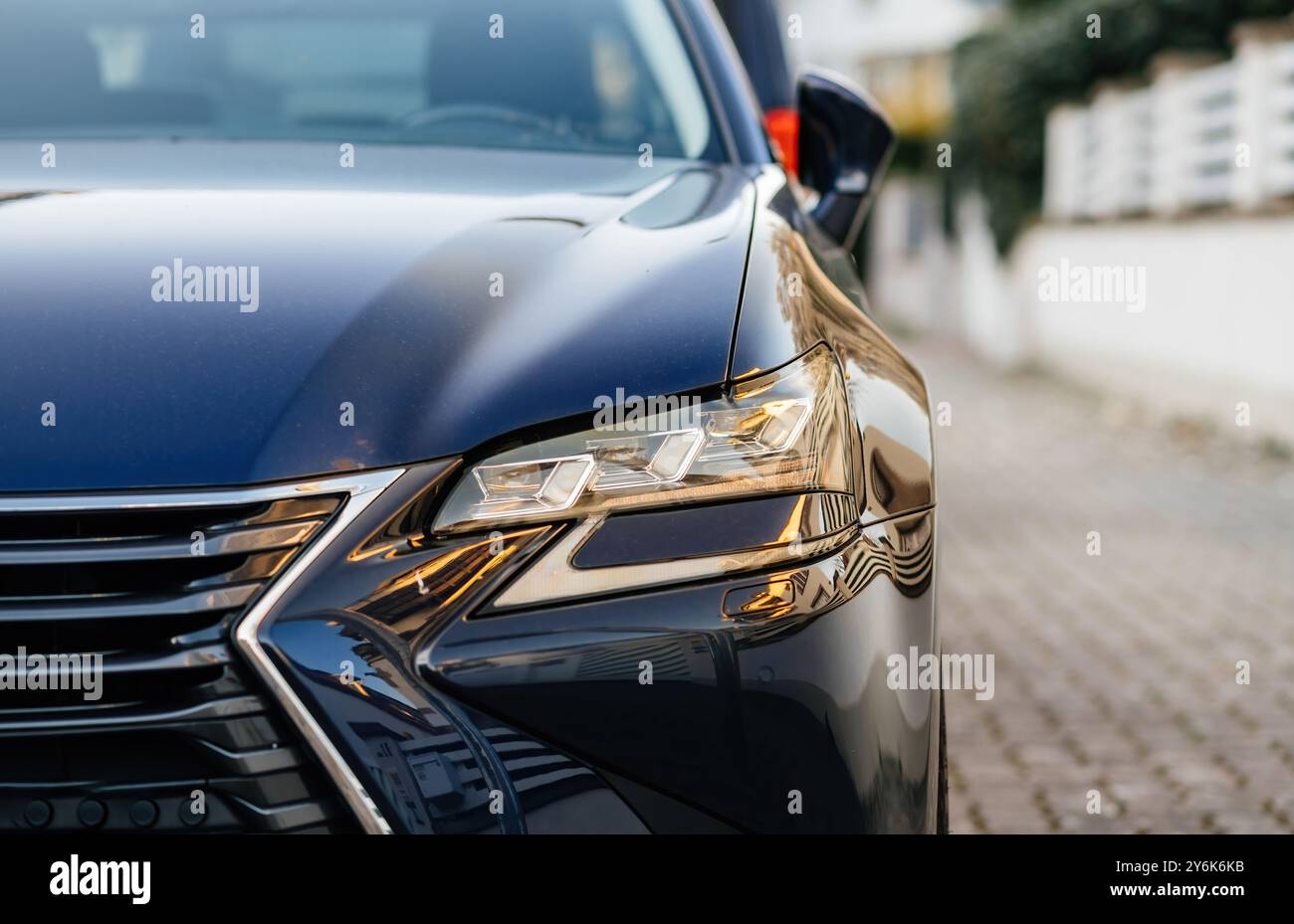 Front view of an aggressive and powerful luxury car with LED bi-xenon ...