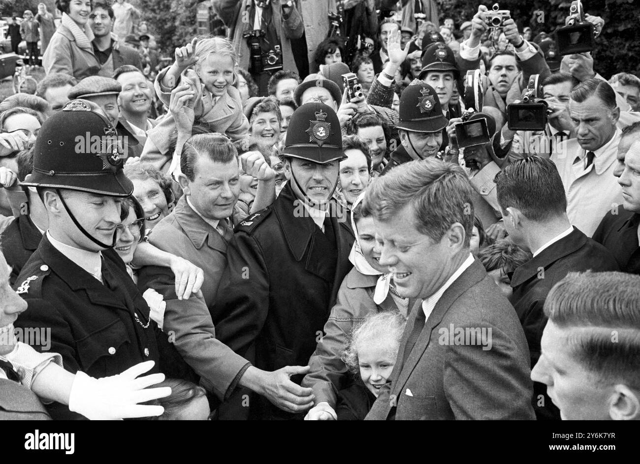 President Kennedy greeting the crowd outside the Roman Catholic Church ...