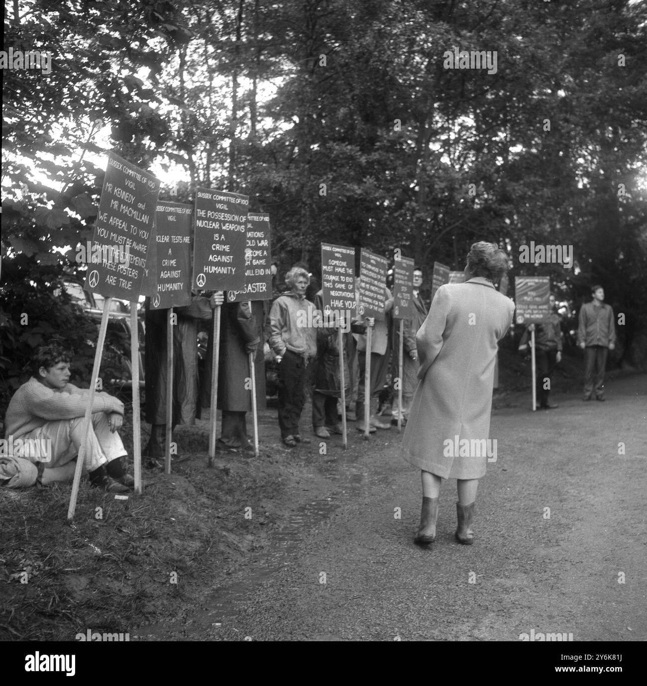 Protestors at gate Black and White Stock Photos & Images - Alamy