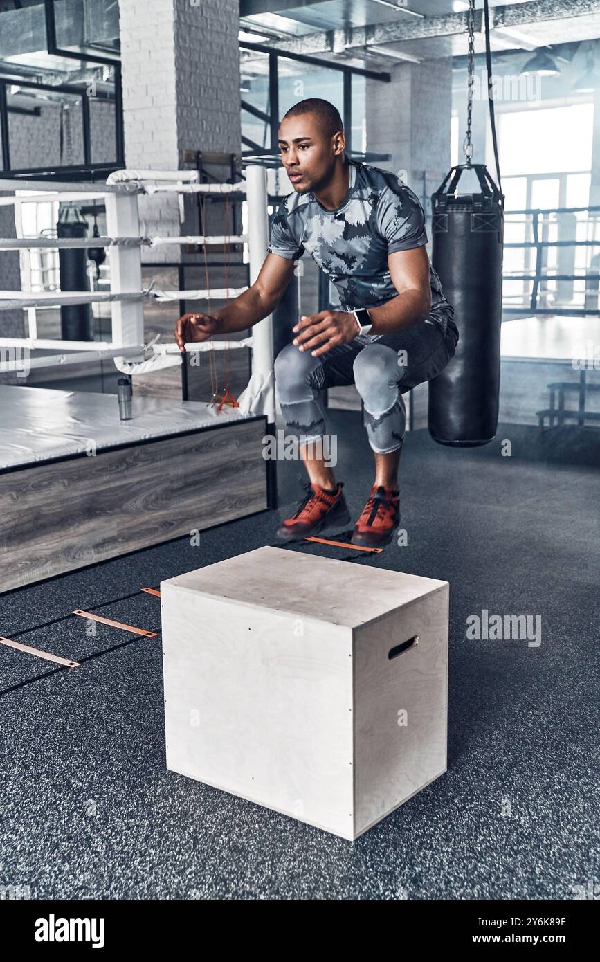 Man long jump gym hi-res stock photography and images - Alamy