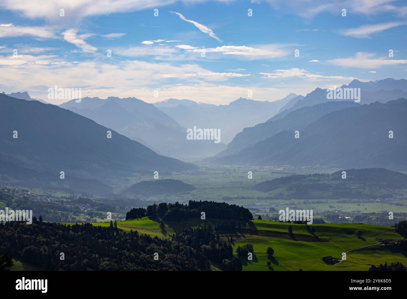 Misty valley in the swiss alps Stock Photo - Alamy