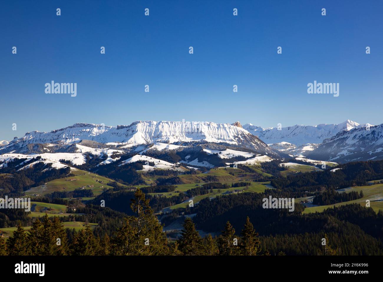 A snowy ridge in the swiss alps with a clear sky Stock Photo - Alamy