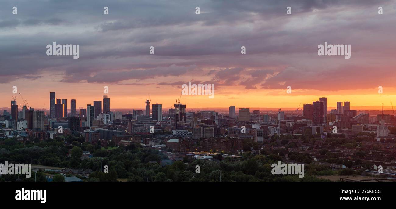 Aerial image of Manchester skyline touched by the golden color of the ...