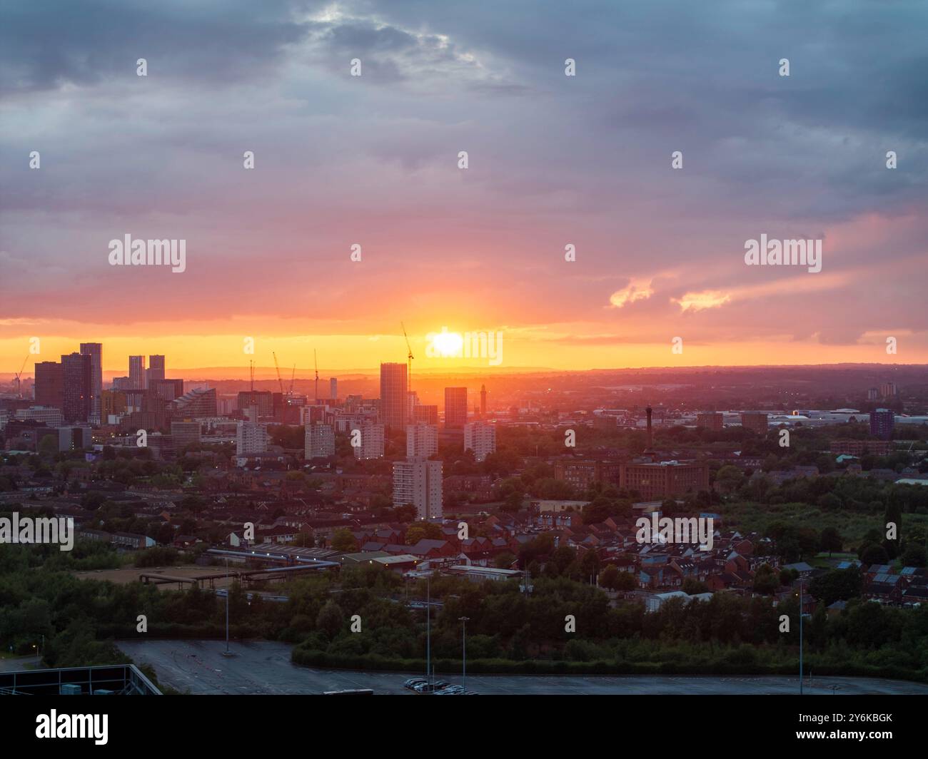 Aerial image of Manchester skyline touched by the golden color of the ...