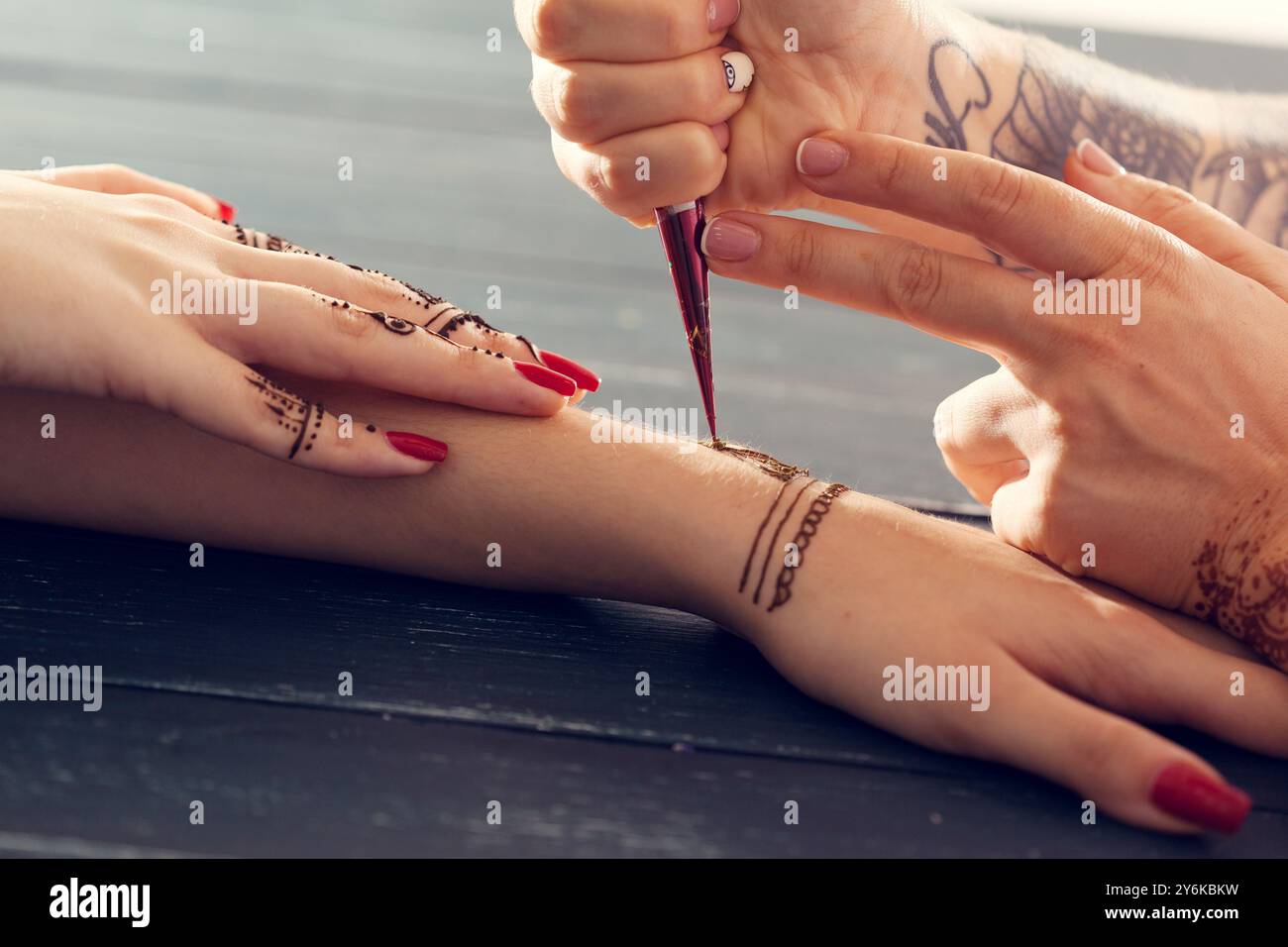 Process of applying mehndi on female hands Stock Photo - Alamy