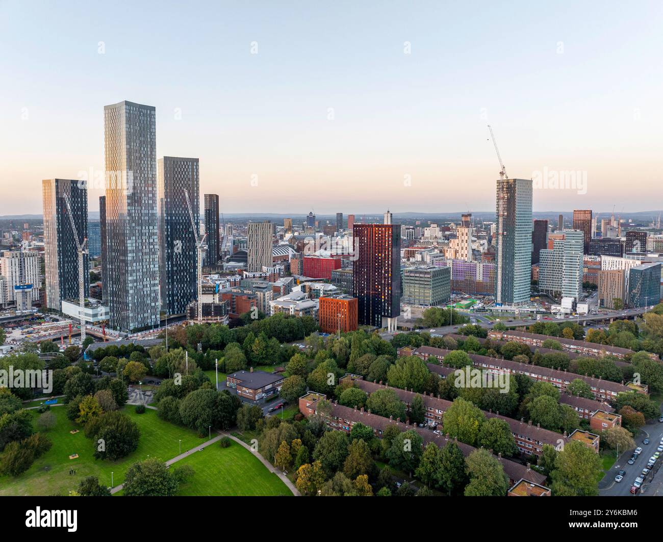 Aerial image of Manchester skyline touched by the golden color of the ...
