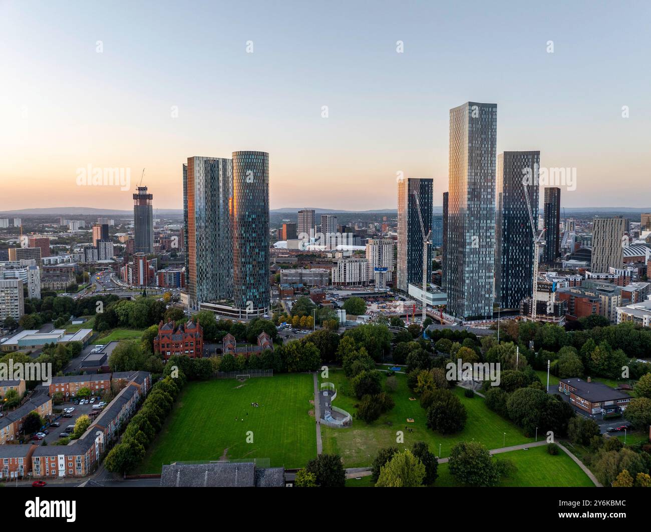 Aerial image of Manchester skyline touched by the golden color of the ...