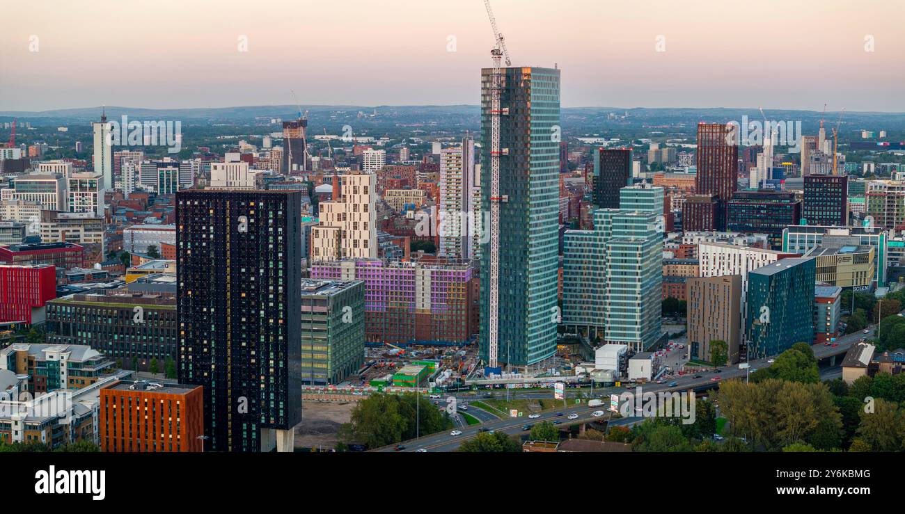 Aerial image of Manchester skyline touched by the golden color of the ...