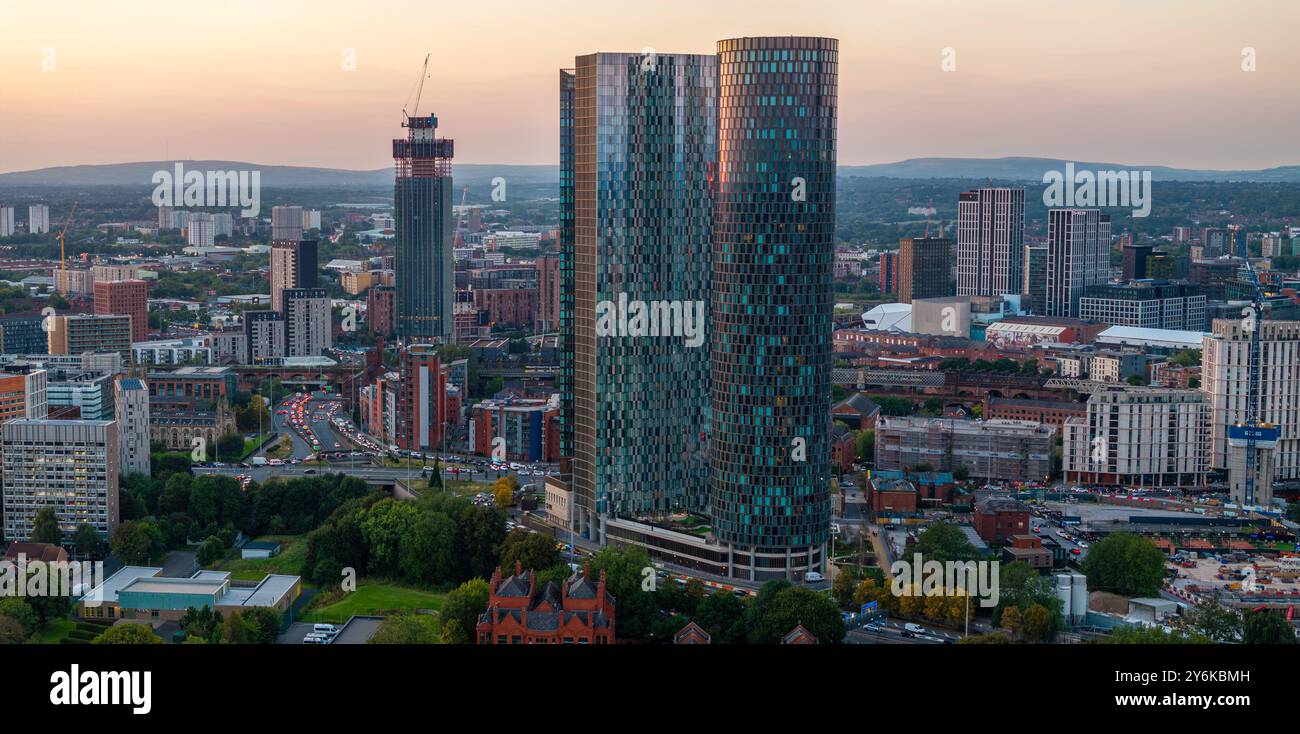 Aerial image of Manchester skyline touched by the golden color of the ...