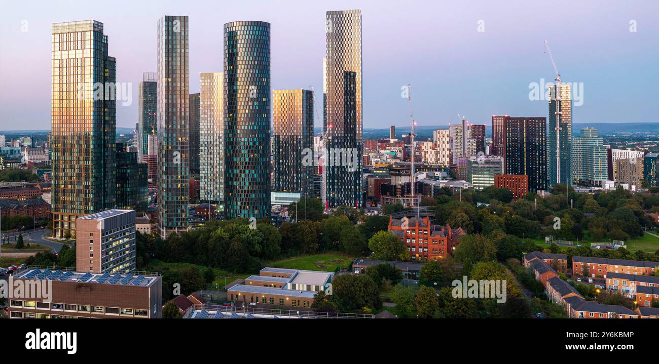 Aerial image of Manchester skyline touched by the golden color of the ...