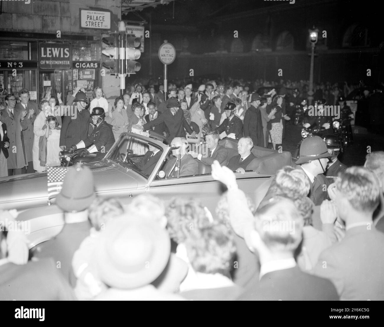 London: Vast crowds press against a police cordon to wave and cheer ...