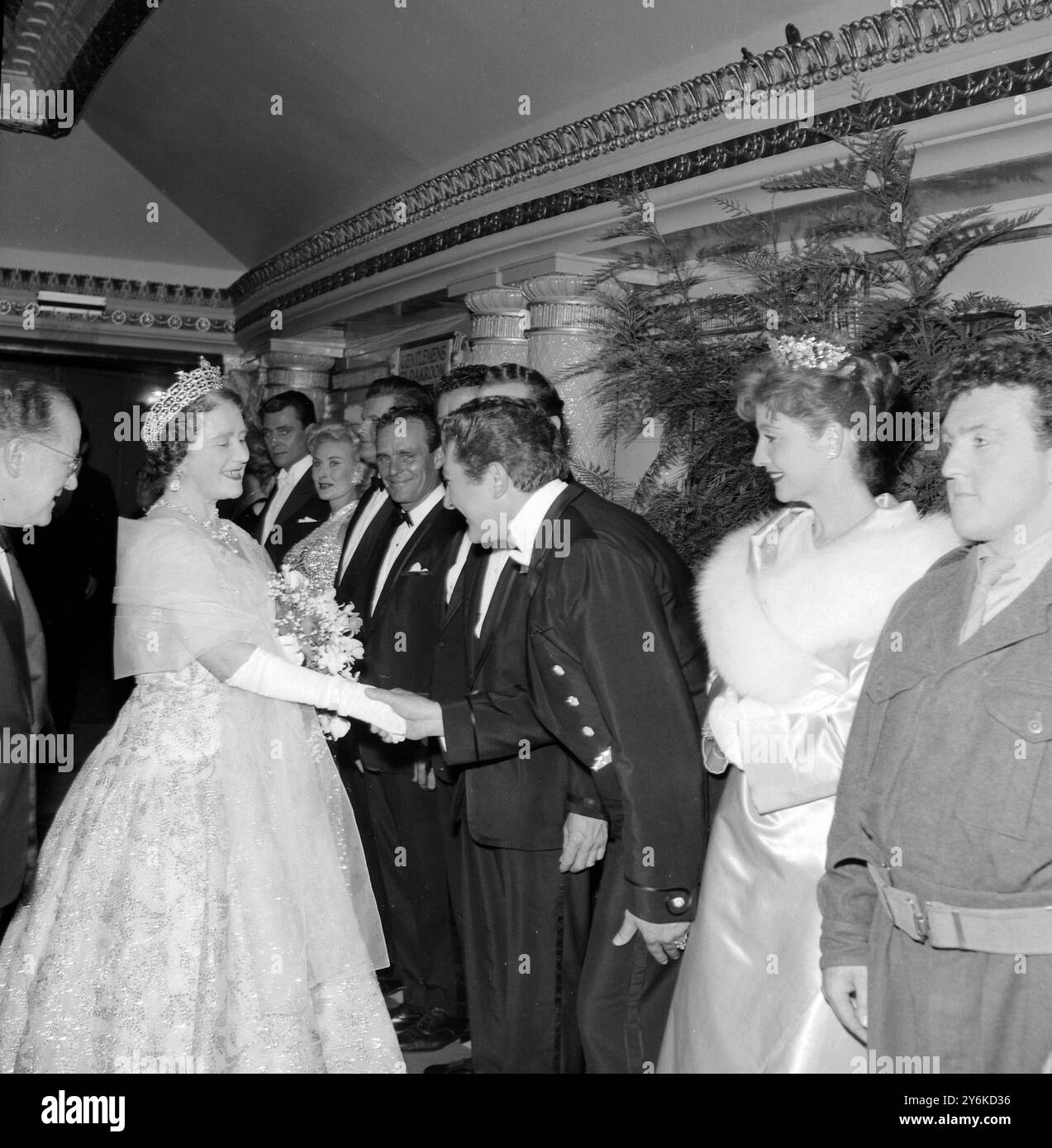 Liberace shakes hands with H M Queen Elizabeth The Queen Mother at ...