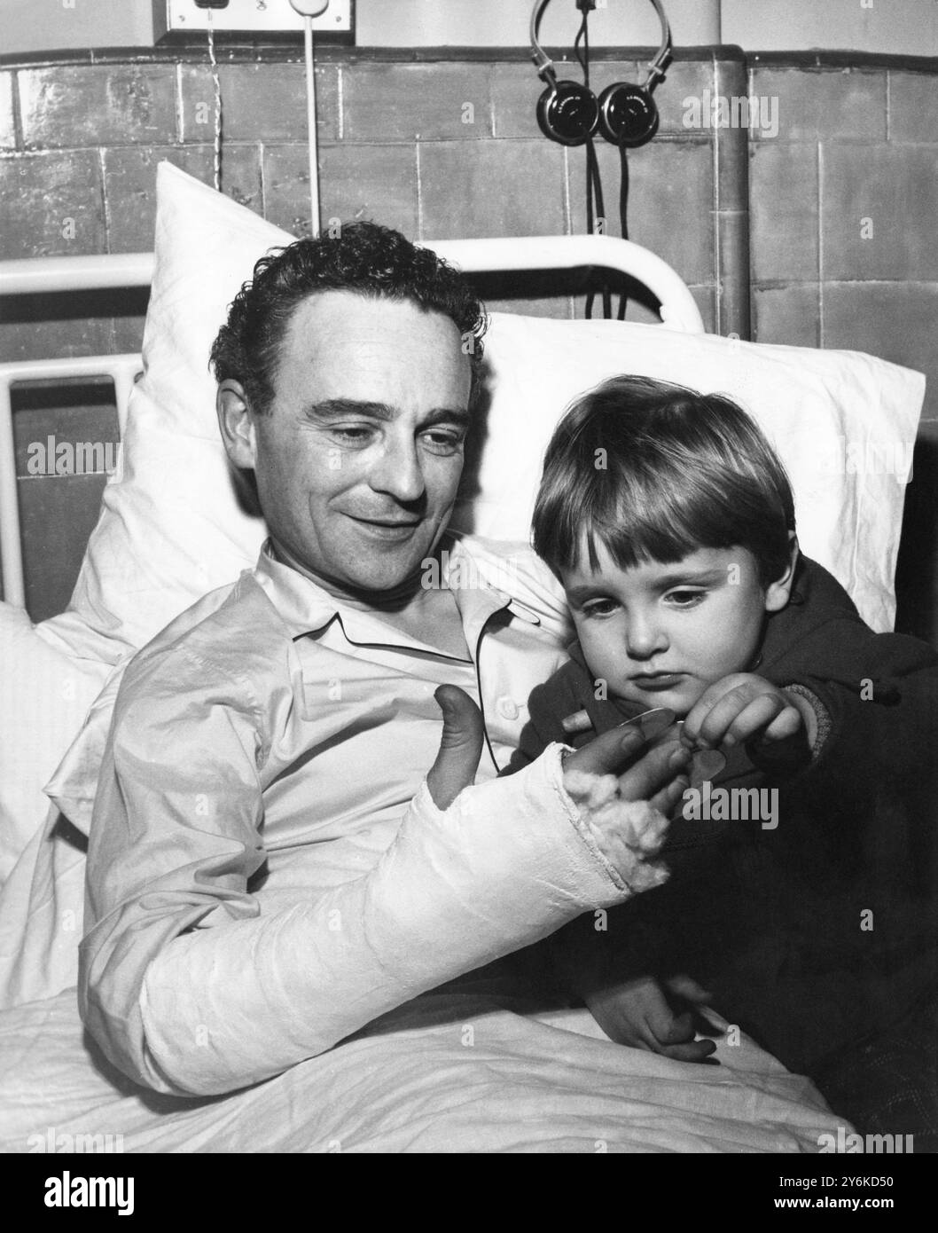 Kenneth Connor and his 3 year old son, Jeremy on the film set of Carry ...