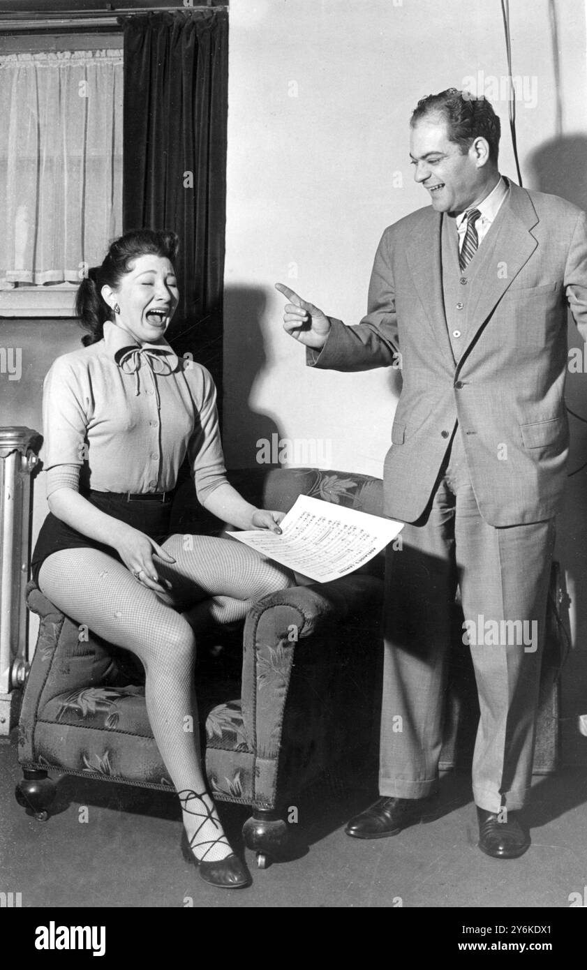 Arthur Lewis , American playwright and author , shows Joyce Blair when to come in with a sneeze ...