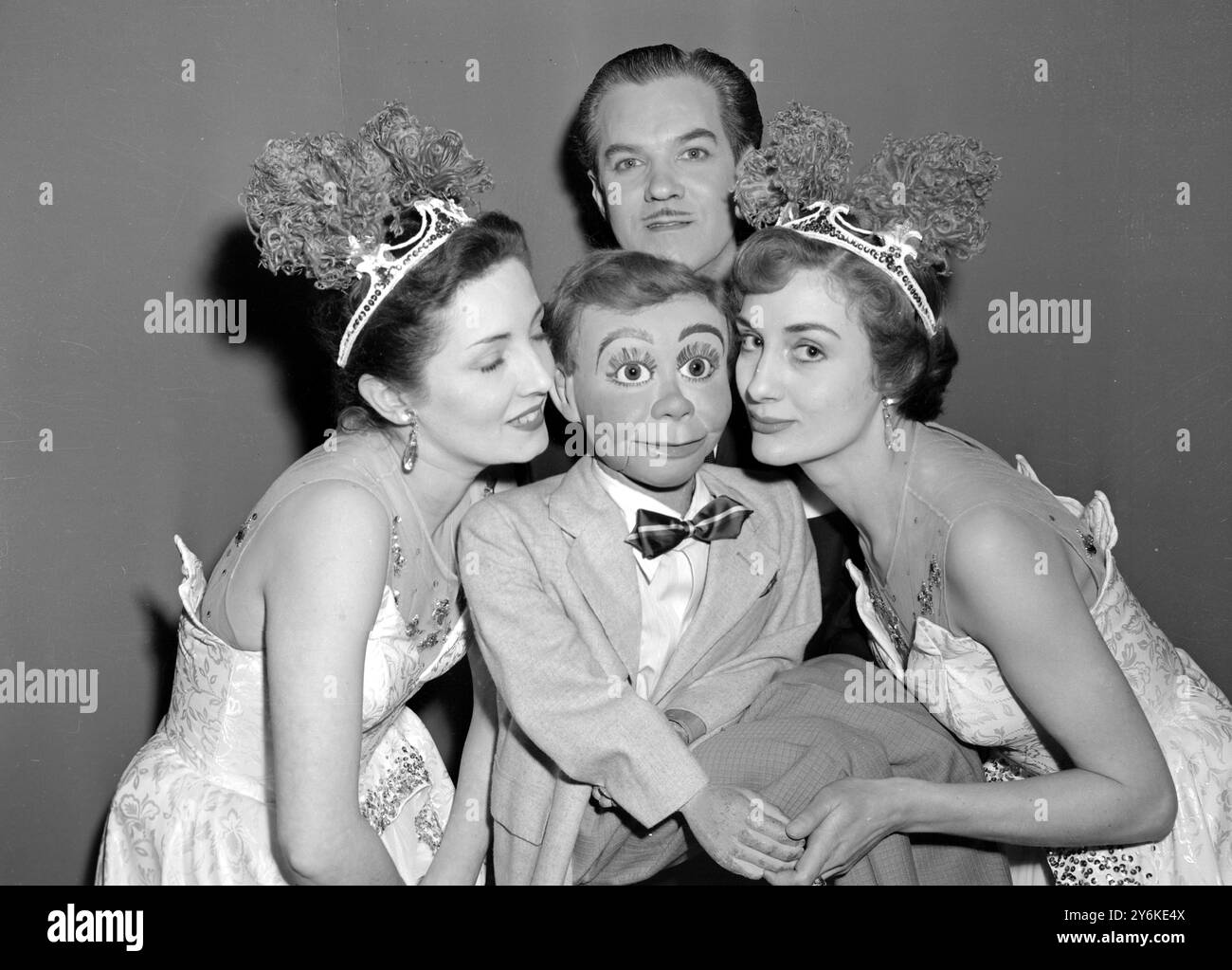 A kiss for Snodgrass from dancers Betty Bold left , and Hazel Johns ...