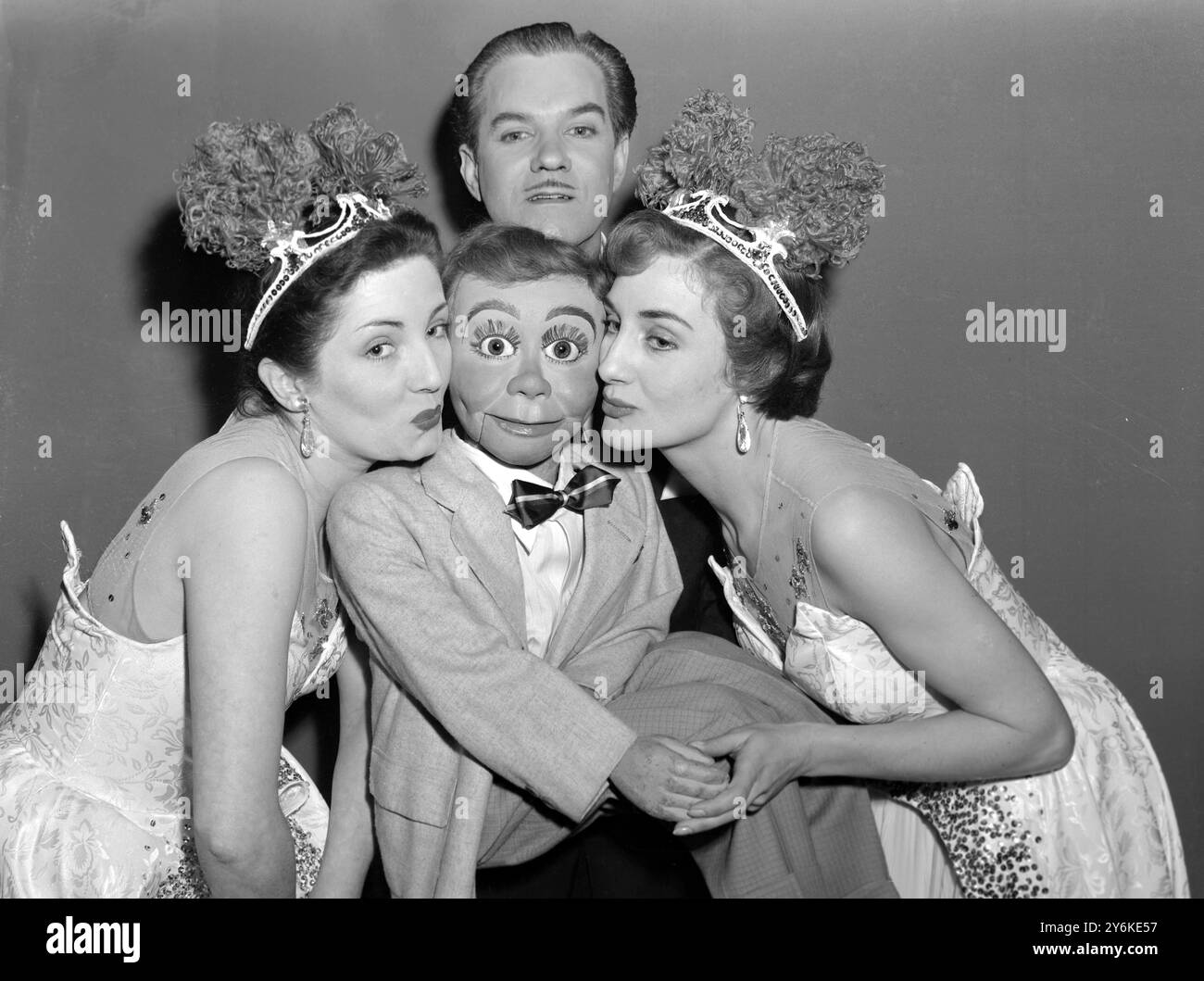 A kiss for Snodgrass from dancers Betty Bold left , and Hazel Johns ...