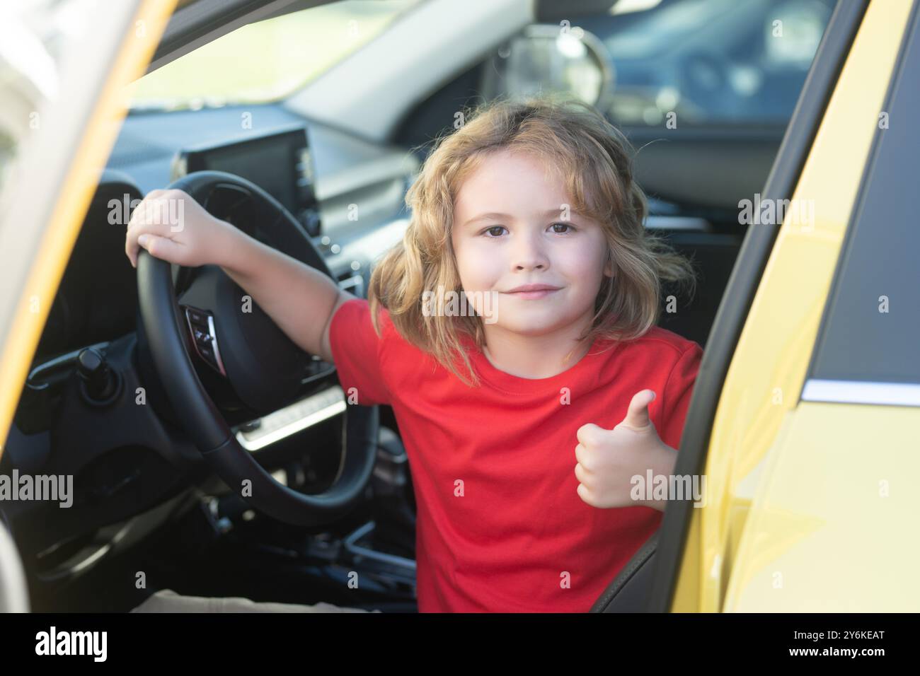 Little Driver. Cute little boy pretending to drive. Kid in car with his ...