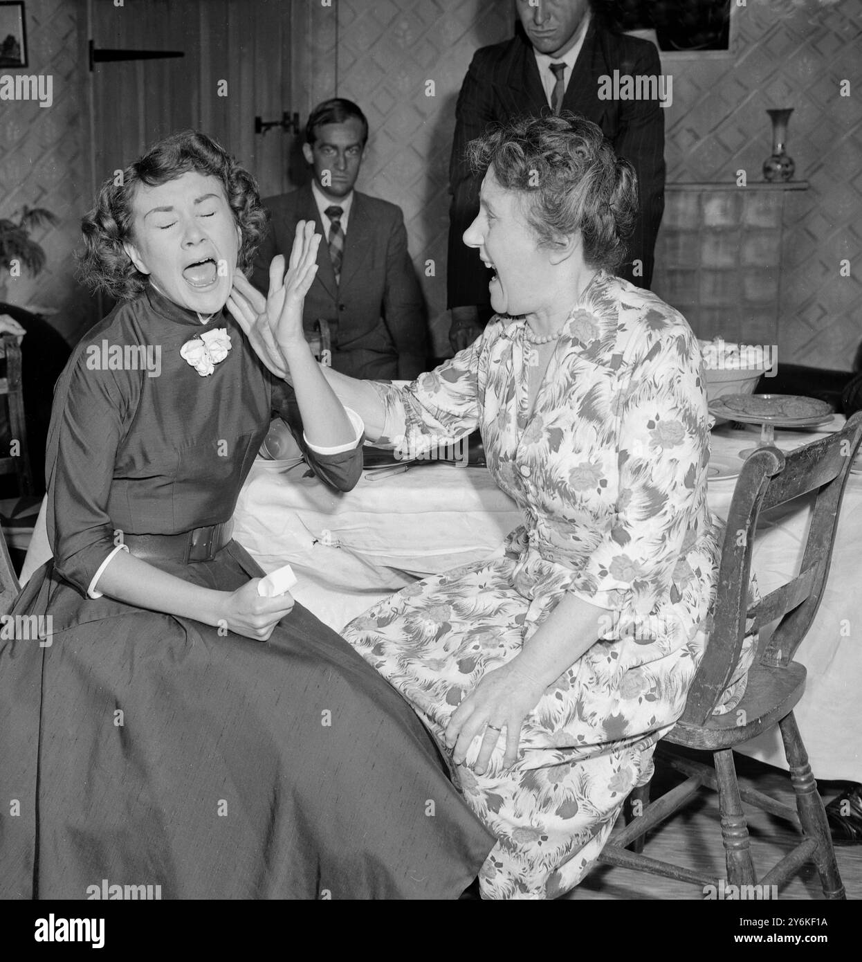 Joan Plowright, playing the part of beatie Bryant, gets a slap from ...