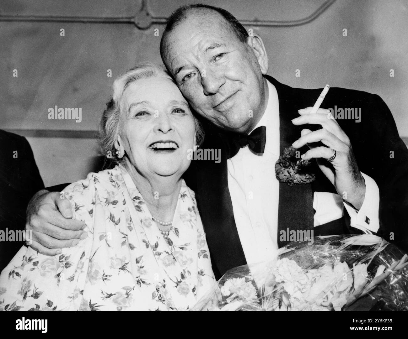 Noel Coward gives Dame Sybil Thorndike a hug backstage , she was the ...