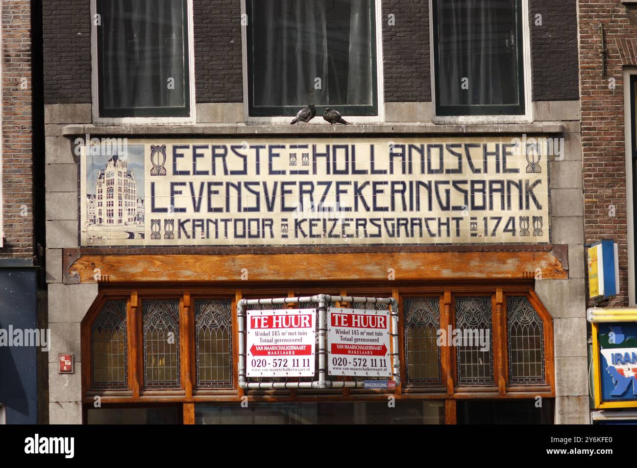 A historic art nouveau storefront of a life insurance company in ...