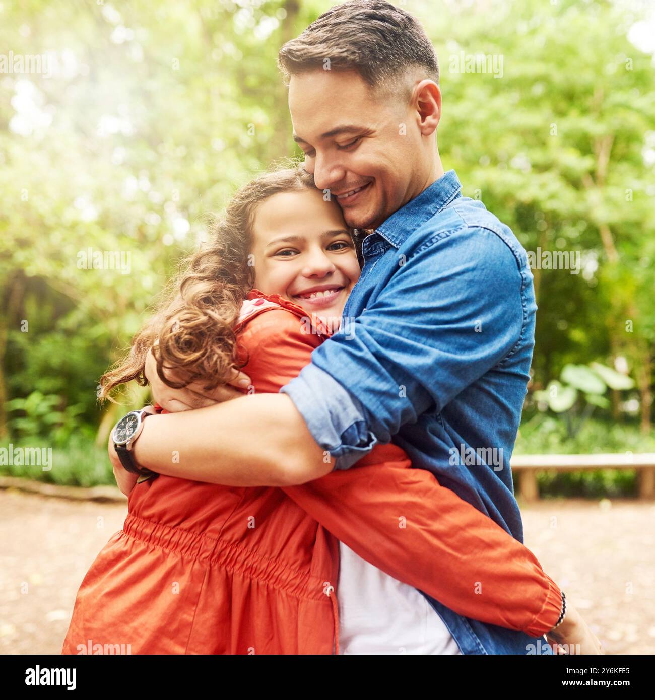 Outdoor, dad and girl in portrait with hug, love and bonding together ...