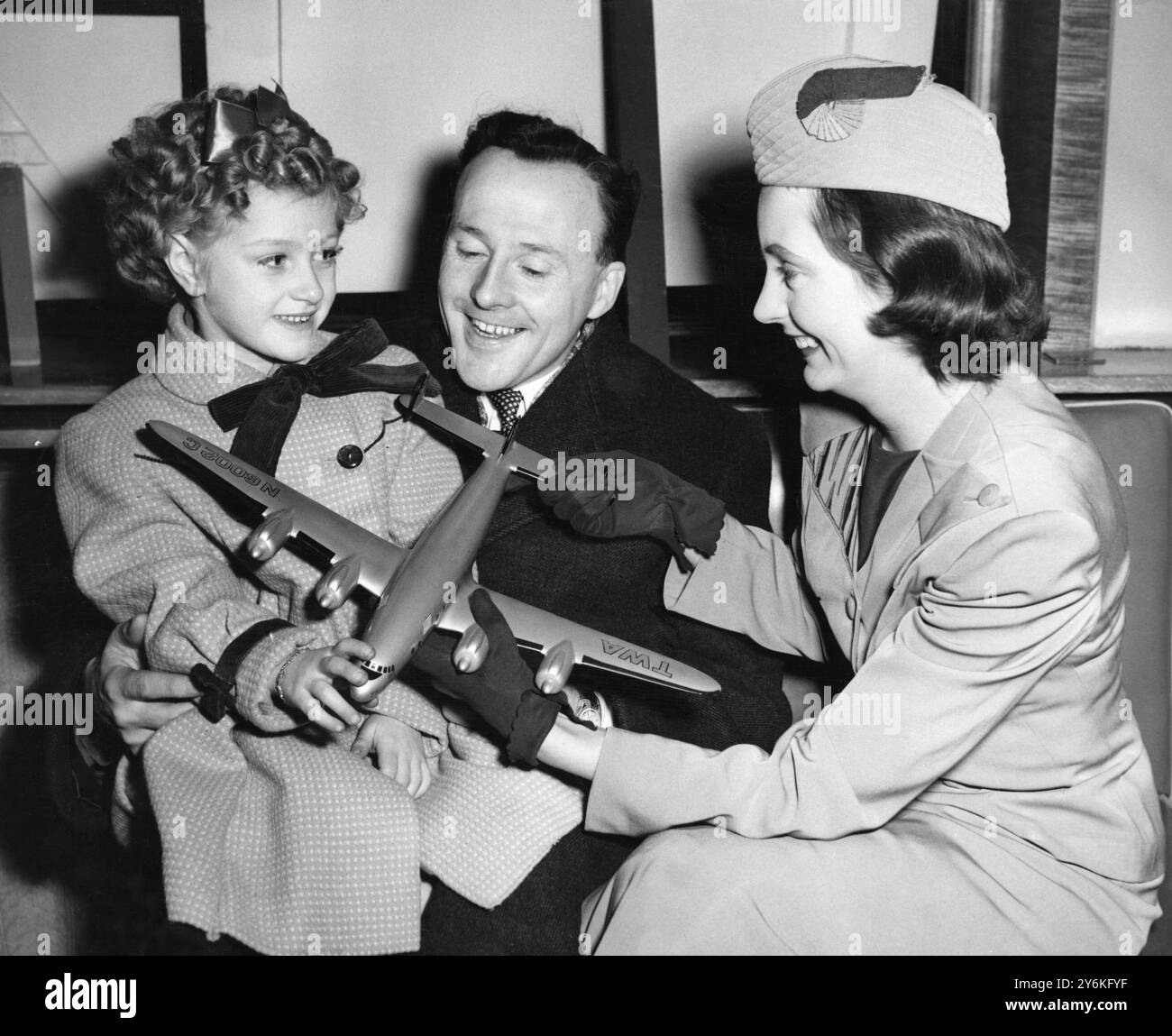 Jimmy Young with Jean Gilliand on his knees at the TWA offices in ...