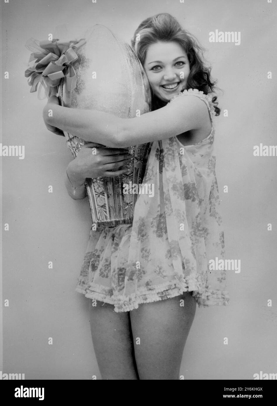 Original 1960s caption follows: Rome: Cheek to chocolate, this lovely ...