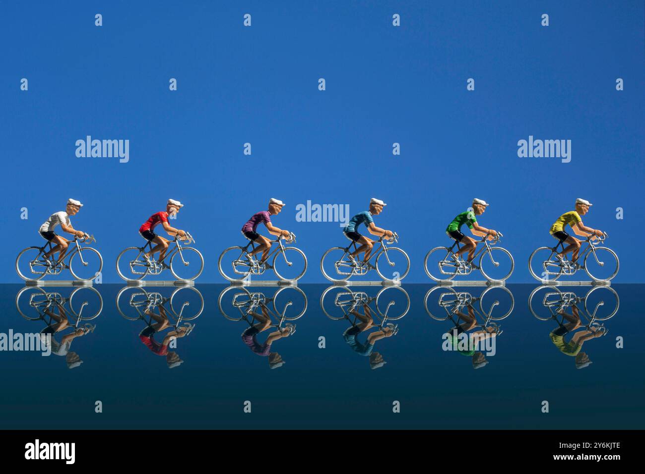 Figurines of cyclists lined up one behind the other Stock Photo - Alamy