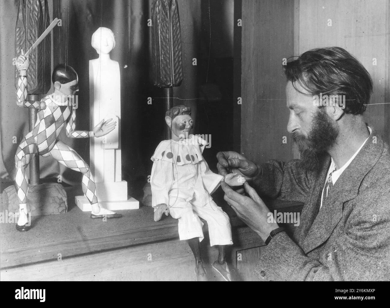THE BRITISH MARIONETTE SOCIETY 1923 Mr A.S. Wilkinson preparing for the ...