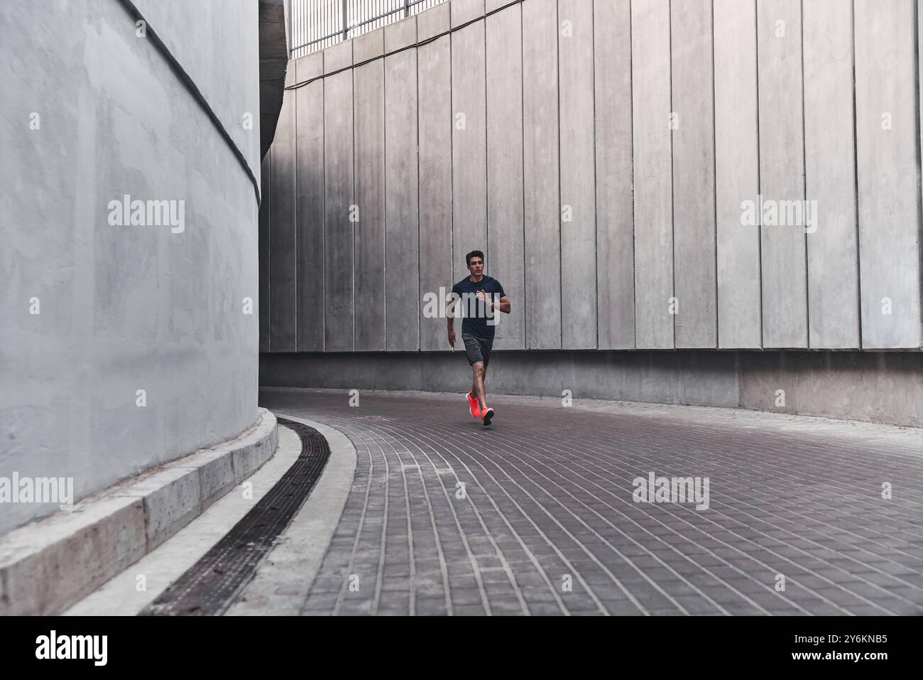 Stronger and faster. Full length of young man in sports clothing ...